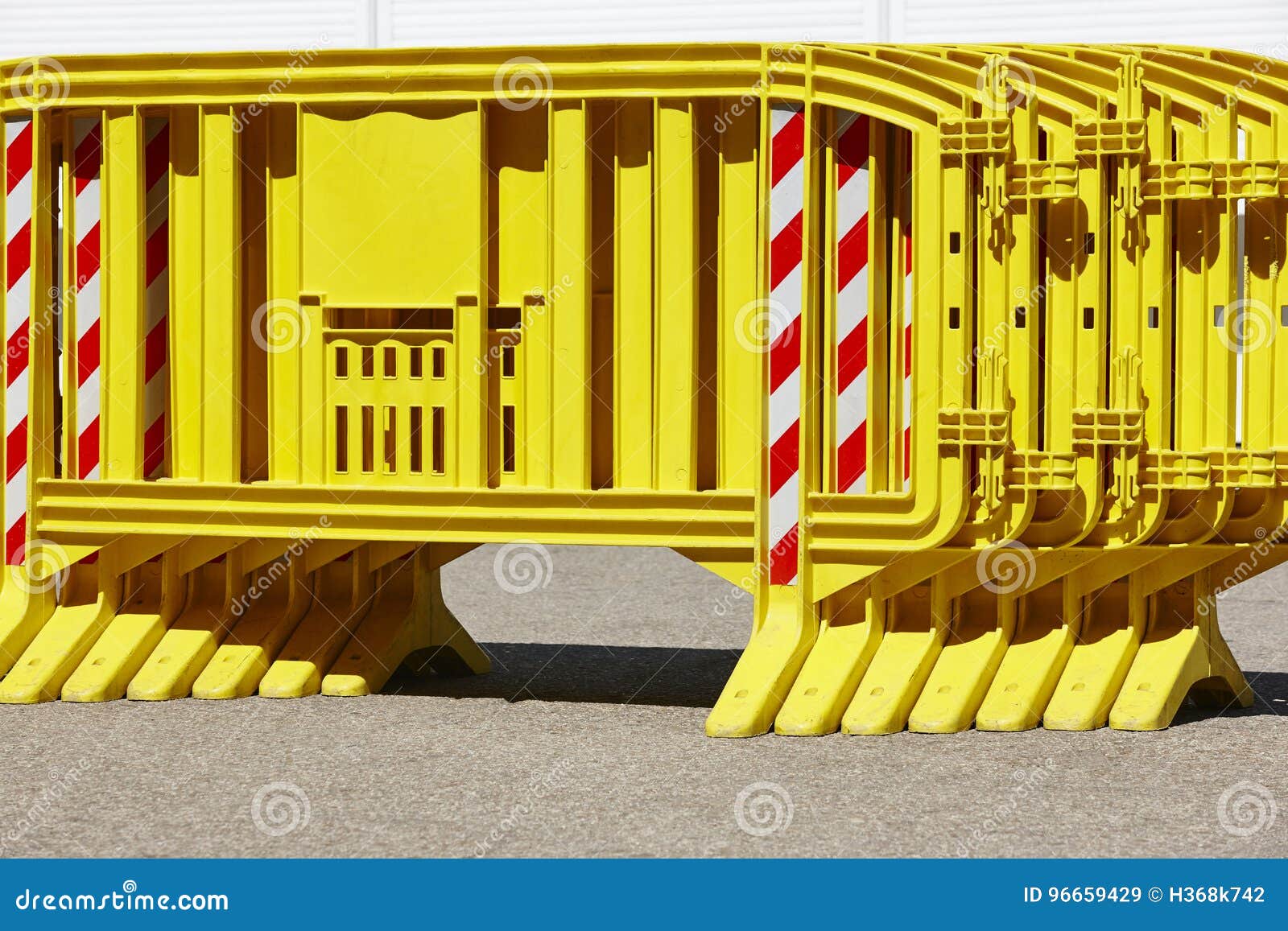 Yellow Plastic Barrier Fence Over an Asphalt Road. Stock Image - Image ...