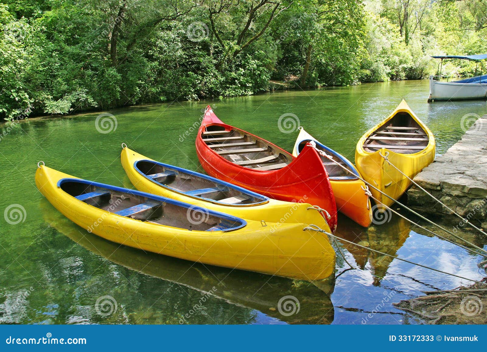 Yellow plastic canoes stock image. Image of camp, boating - 33172333