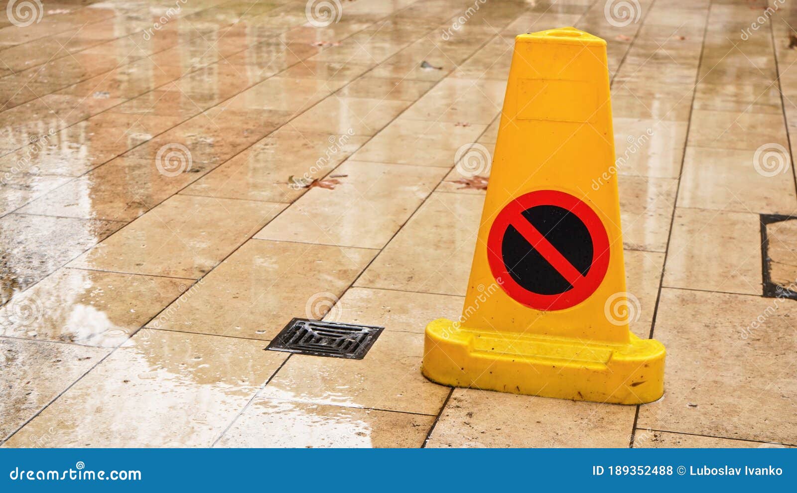 Yellow Plastic Cone with Warning Sign on Slippery Wet Tile Floor Stock ...