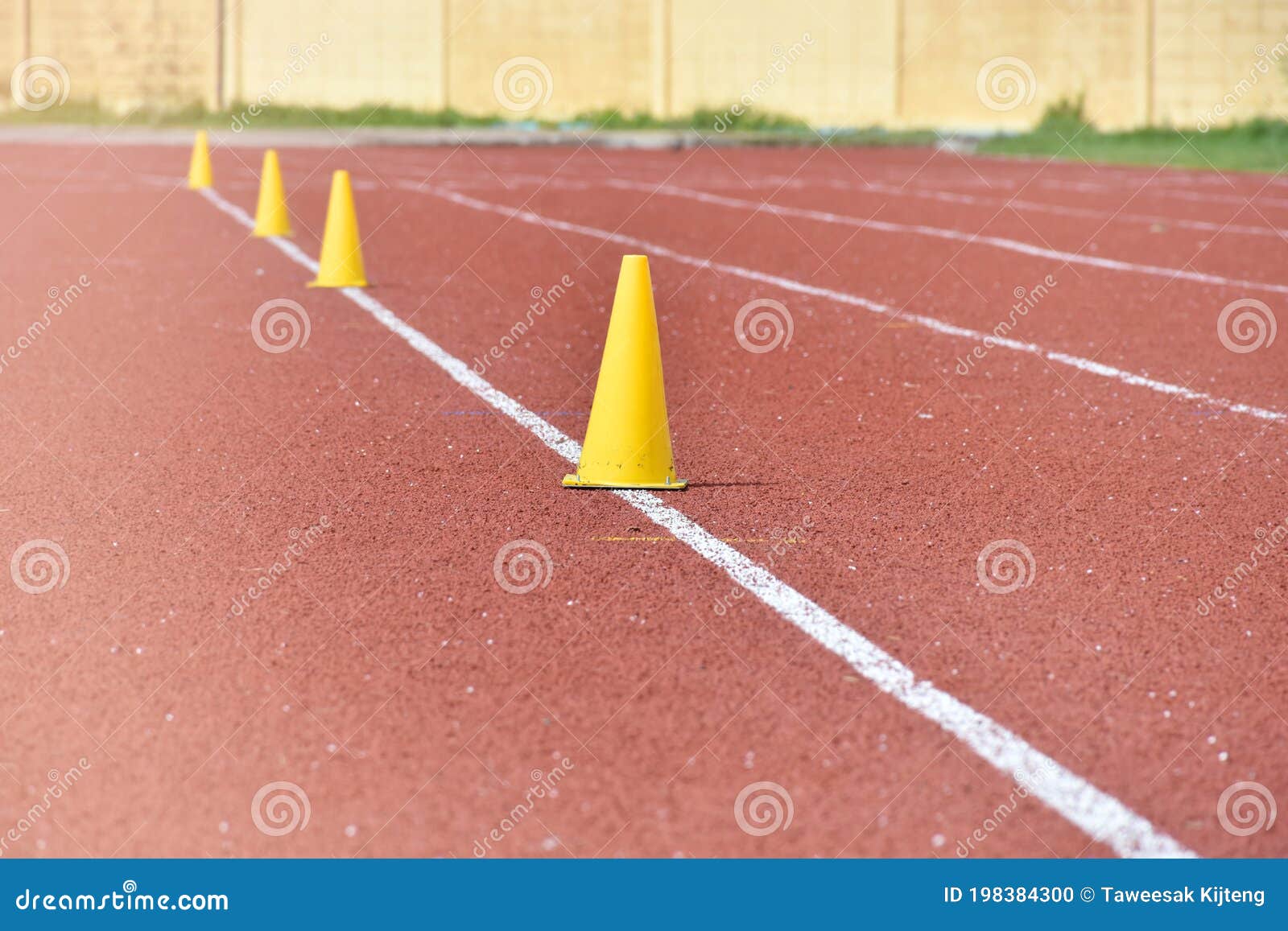 Yellow Plastic Funnel for Athlete Use Practice on Running Track Stock ...