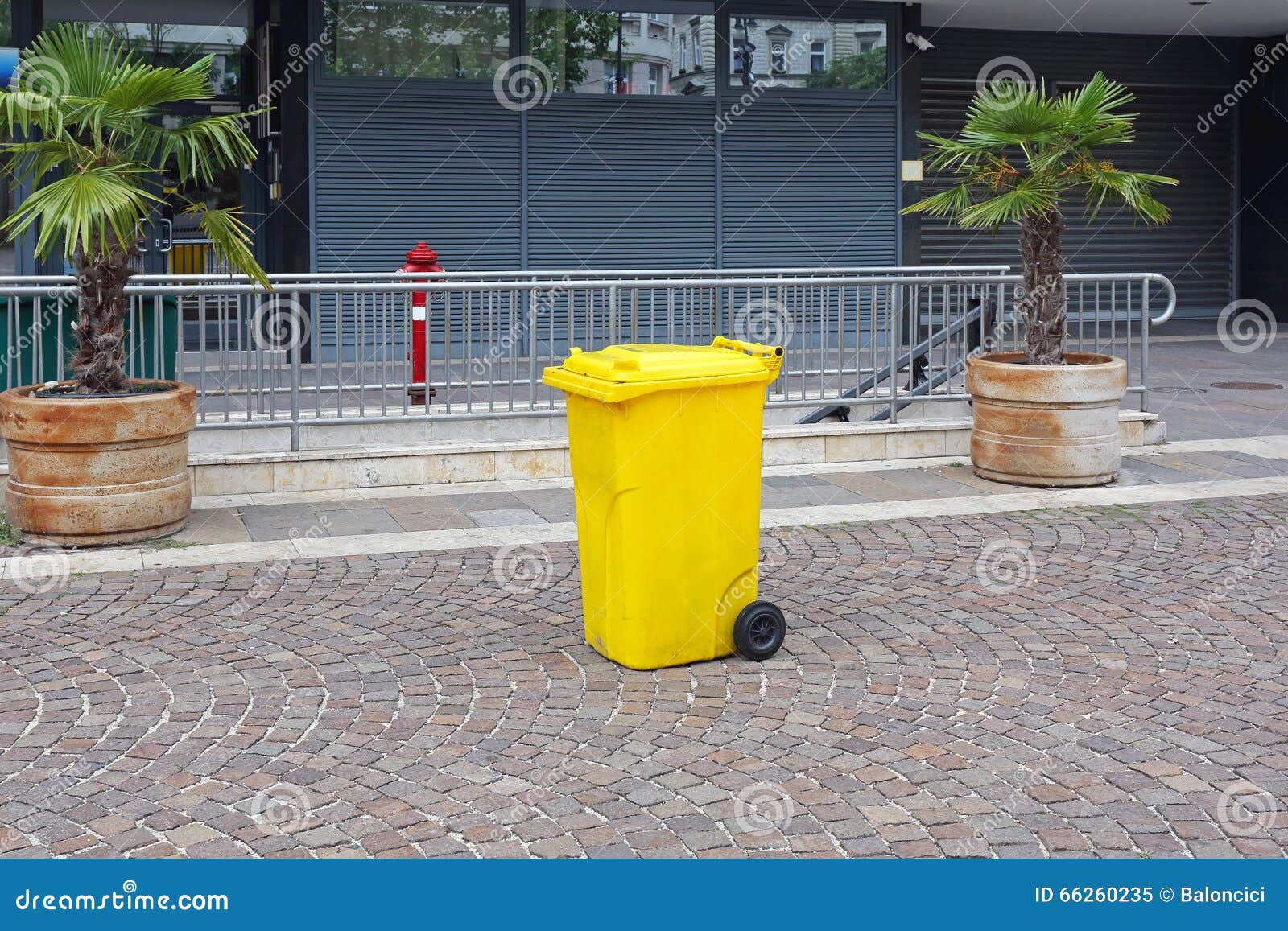 Yellow Plastic Garbage Bin stock image. Image of plastic - 66260235