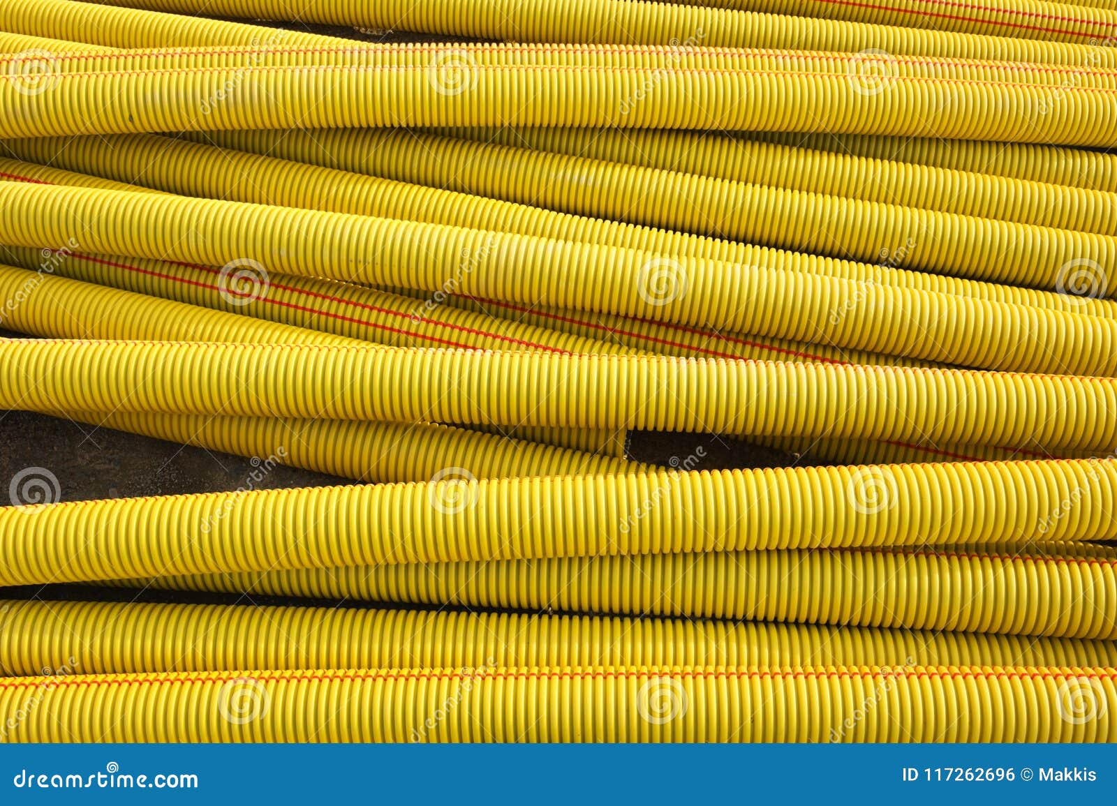 Yellow Plastic Pipes in the Sand Stock Photo - Image of outdoors, pipe ...