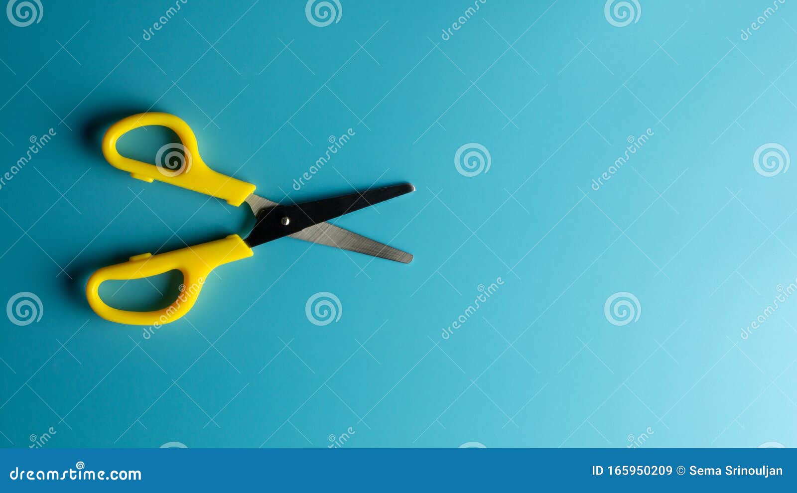 Yellow Plastic Scissors on Blue Paper. Stock Image - Image of blade ...