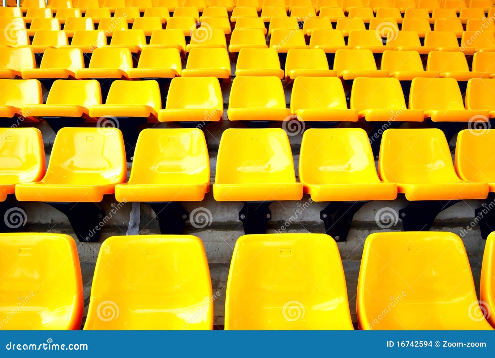 Yellow plastic seats stock photo. Image of color, circus - 16742594