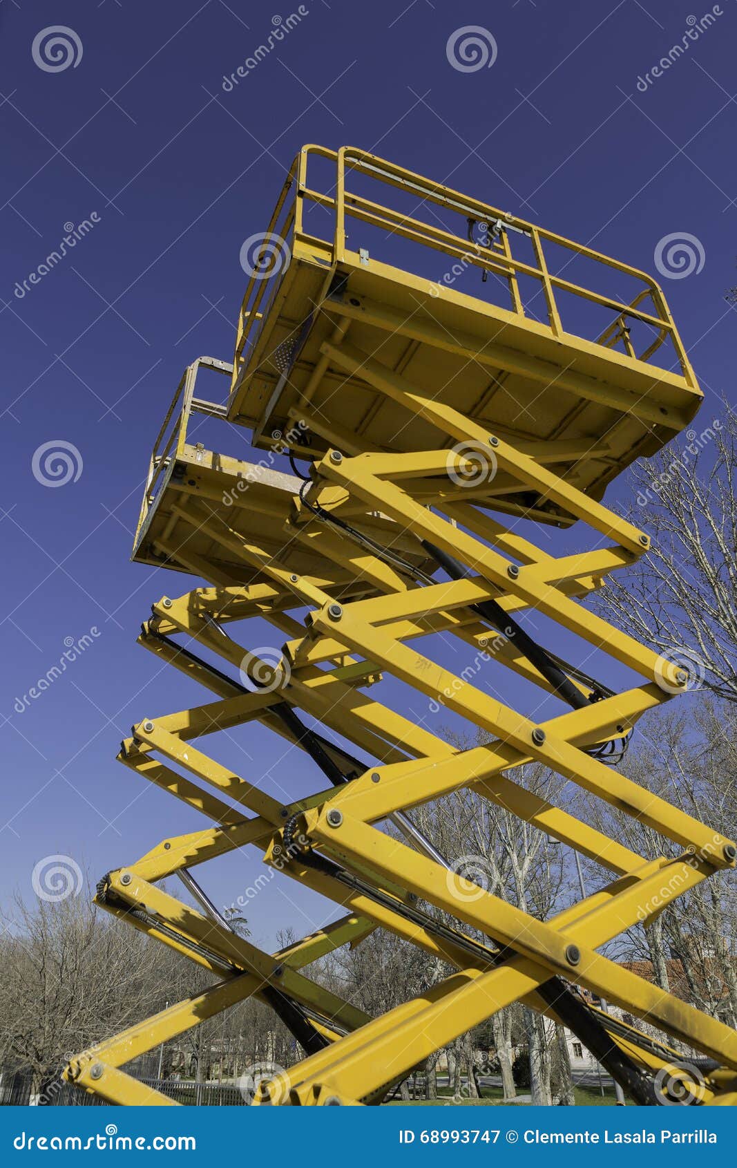 Yellow Platform Lift on Blue Sky Stock Image - Image of lifting ...