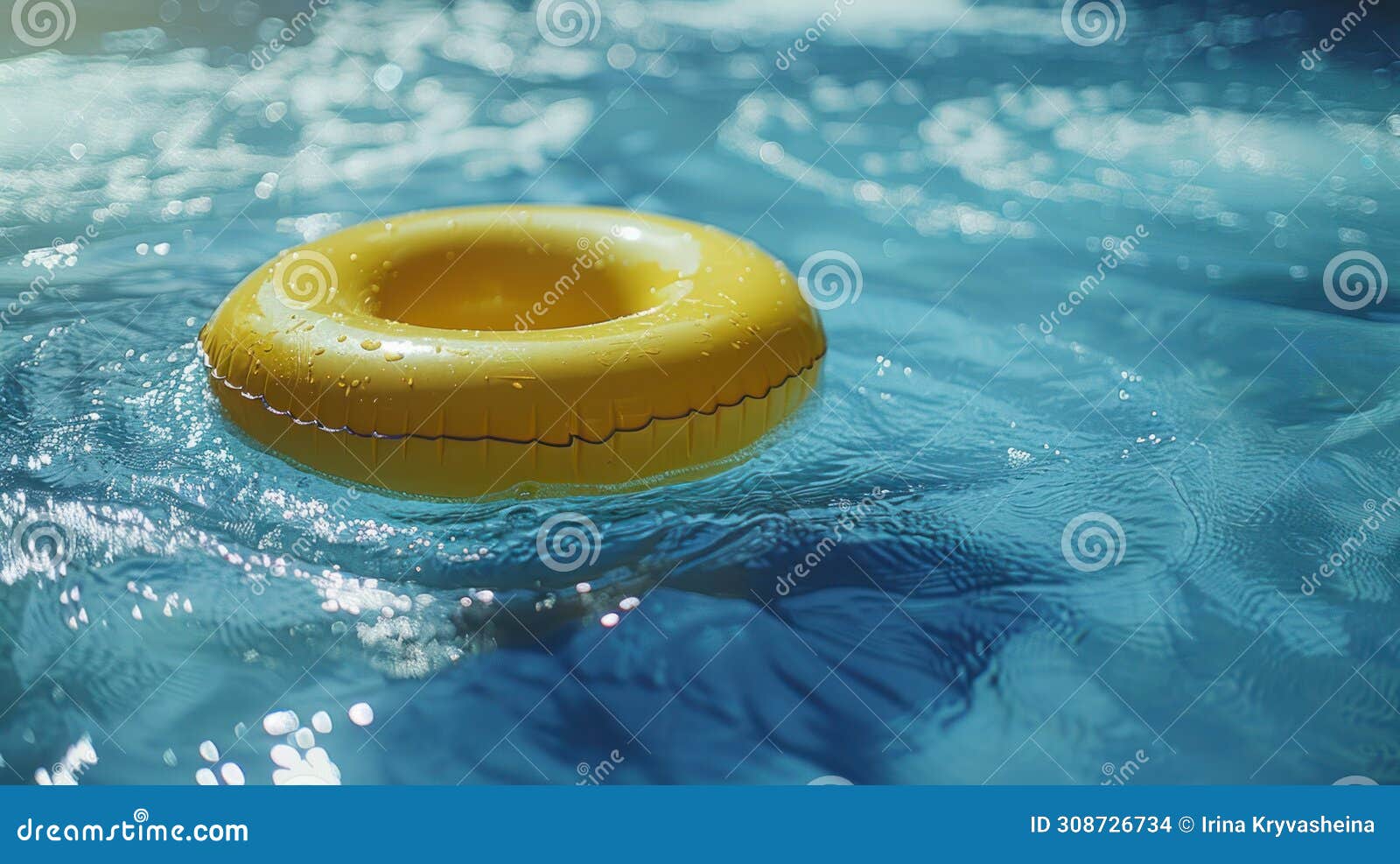 A Yellow Pool Float Ring Drifts in a Cool, Blue Swimming Pool Stock ...