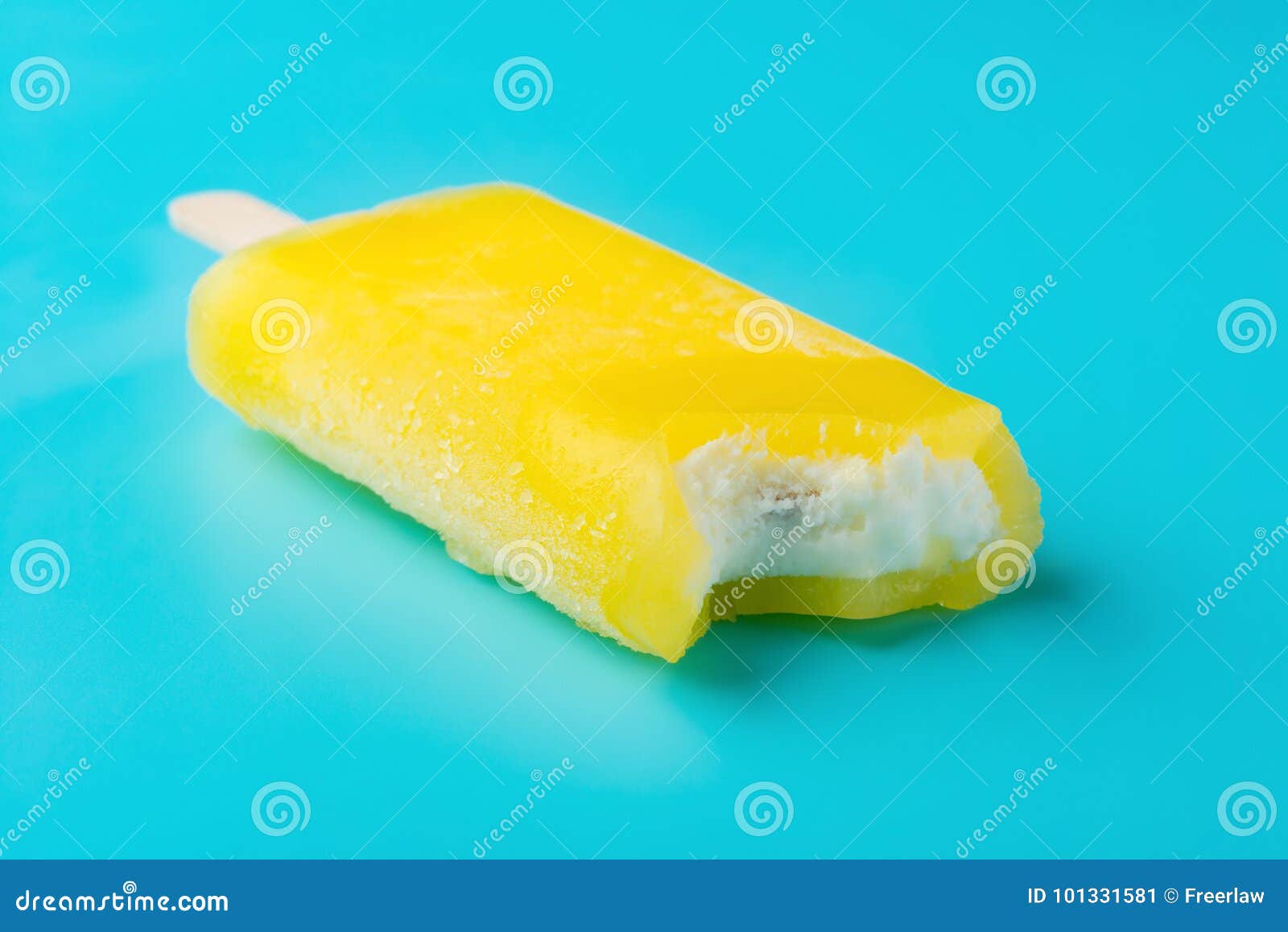 Yellow Popsicle with Bites on Blue Background Stock Image - Image of ...