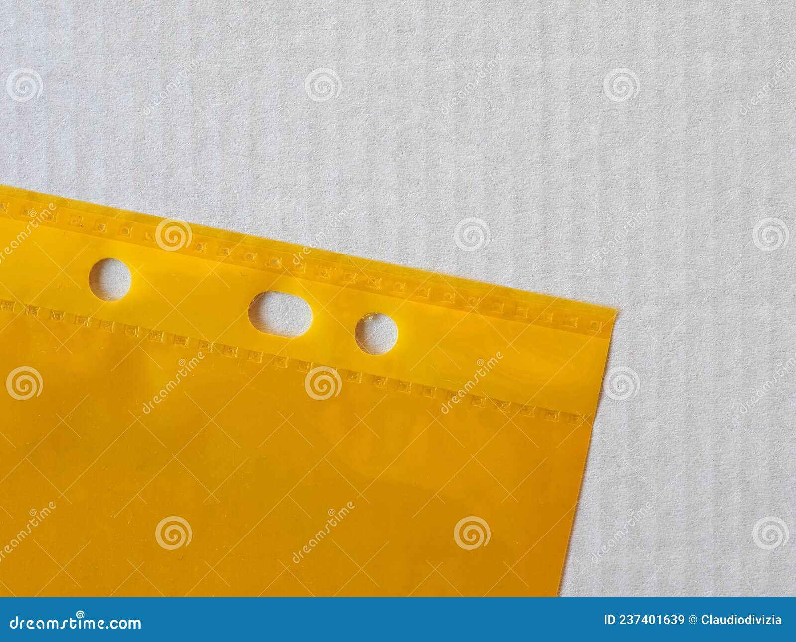 Yellow punched pocket stock image. Image of punched - 237401639