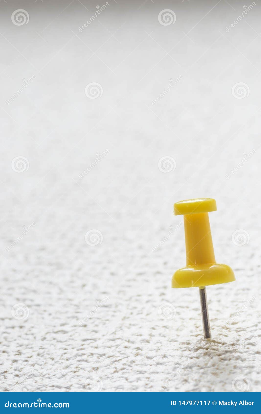 A Yellow Push Pin is Pinned on a White Surface. Stock Image - Image of ...