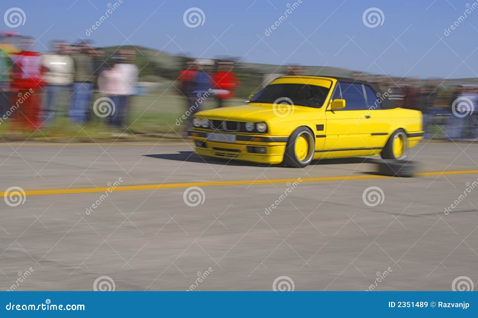 Yellow racing car stock image. Image of road, automobile - 2351489