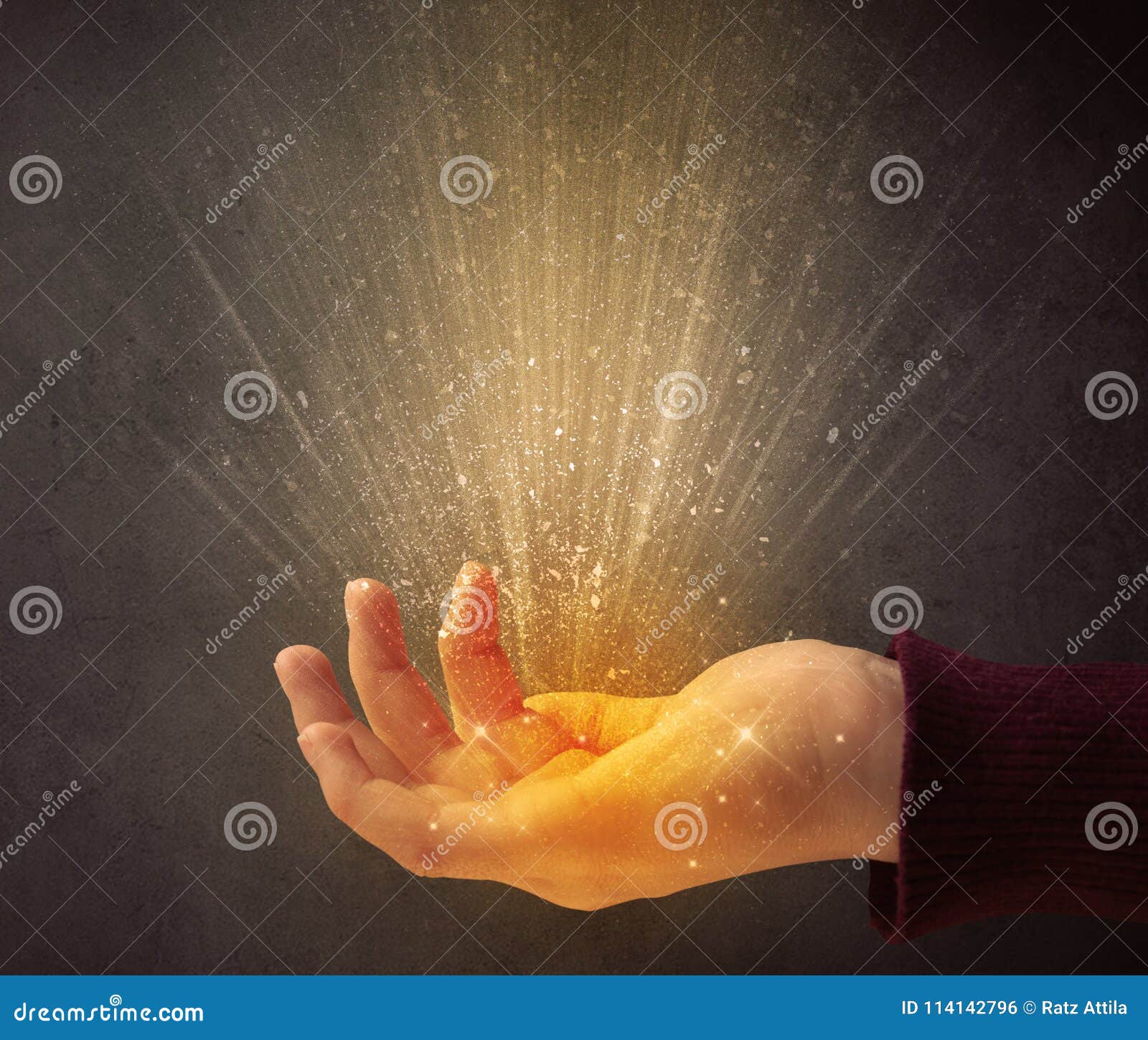 Hand holding yellow light stock photo. Image of charity - 114142796