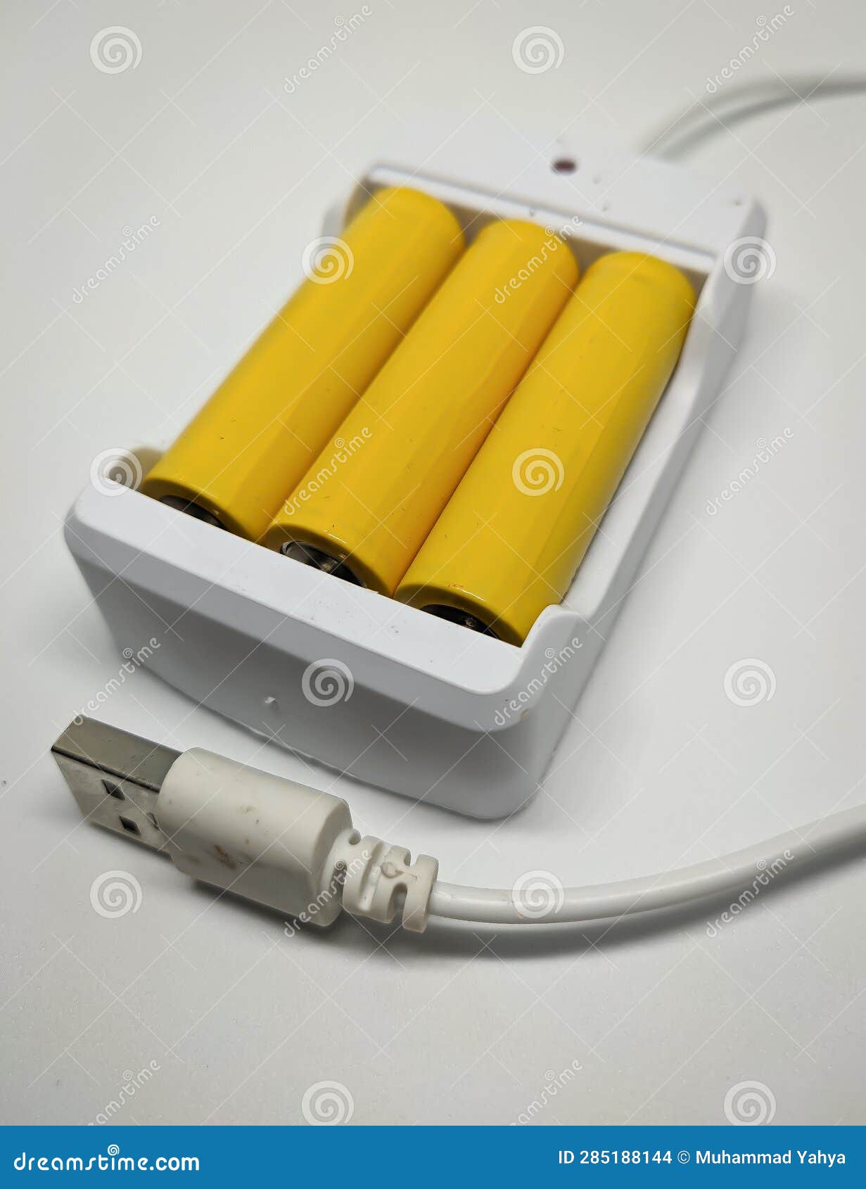 Yellow Rechargeable Battery and Charger Stock Photo - Image of charger ...