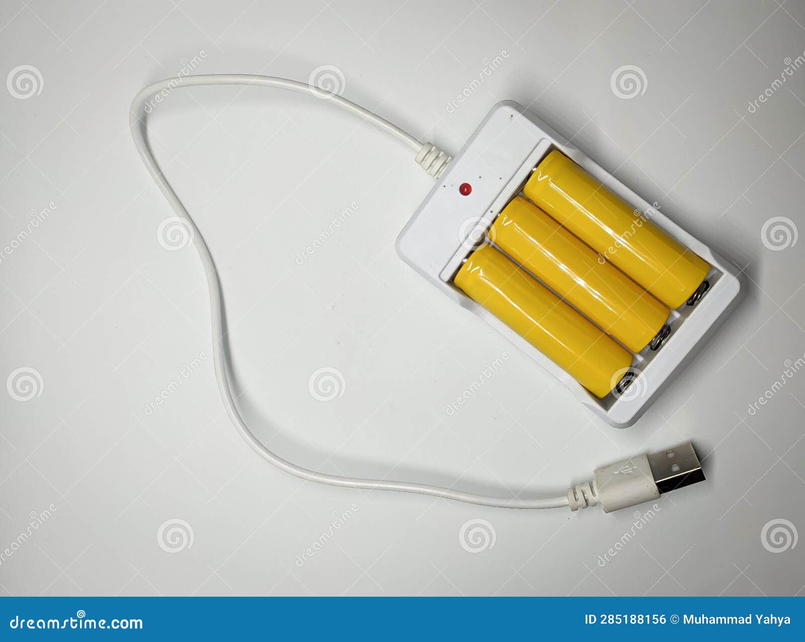 Yellow Rechargeable Battery and Charger Stock Photo - Image of ...
