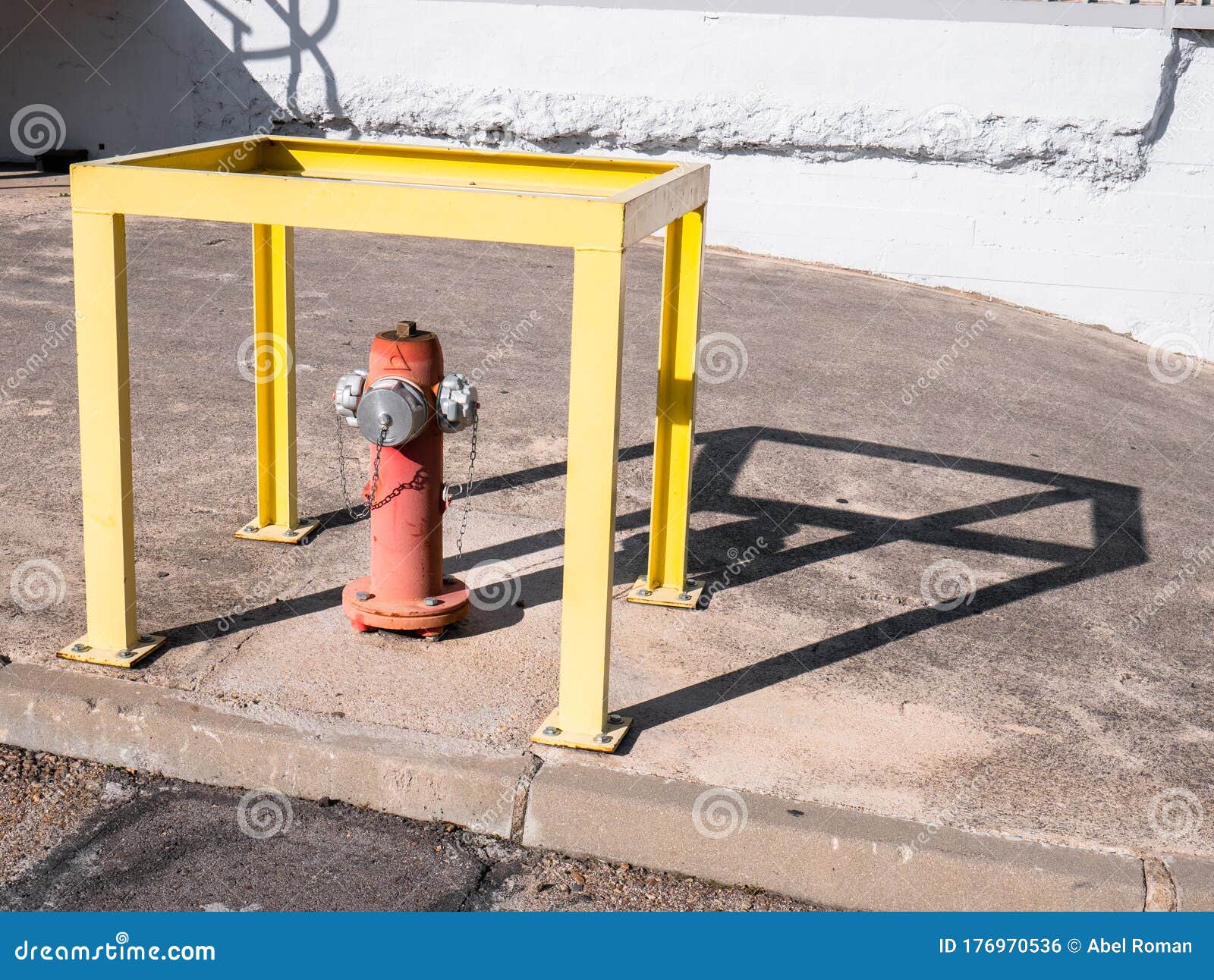 Yellow Rectangular Metal Structure Protecting a Fire Hydrant Stock ...