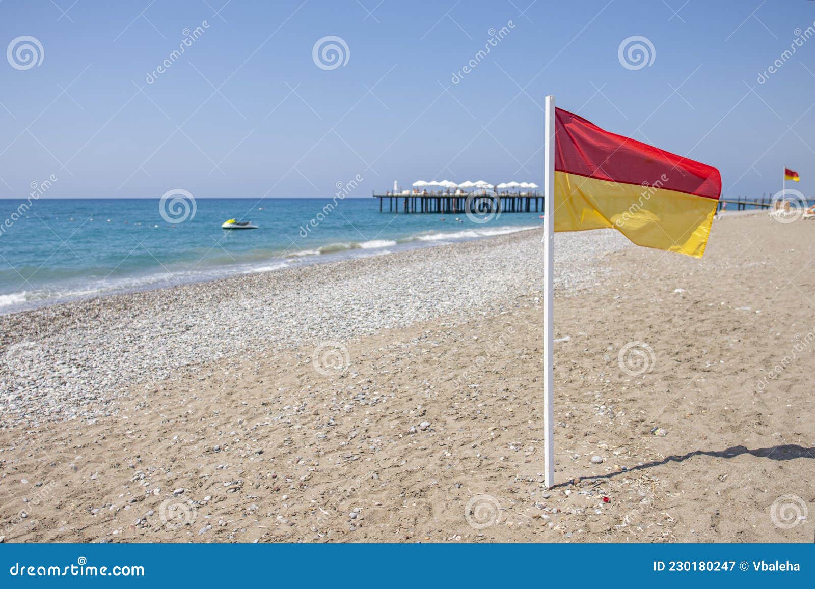 Yellow-red lifeguard flag stock image. Image of tourist - 230180247