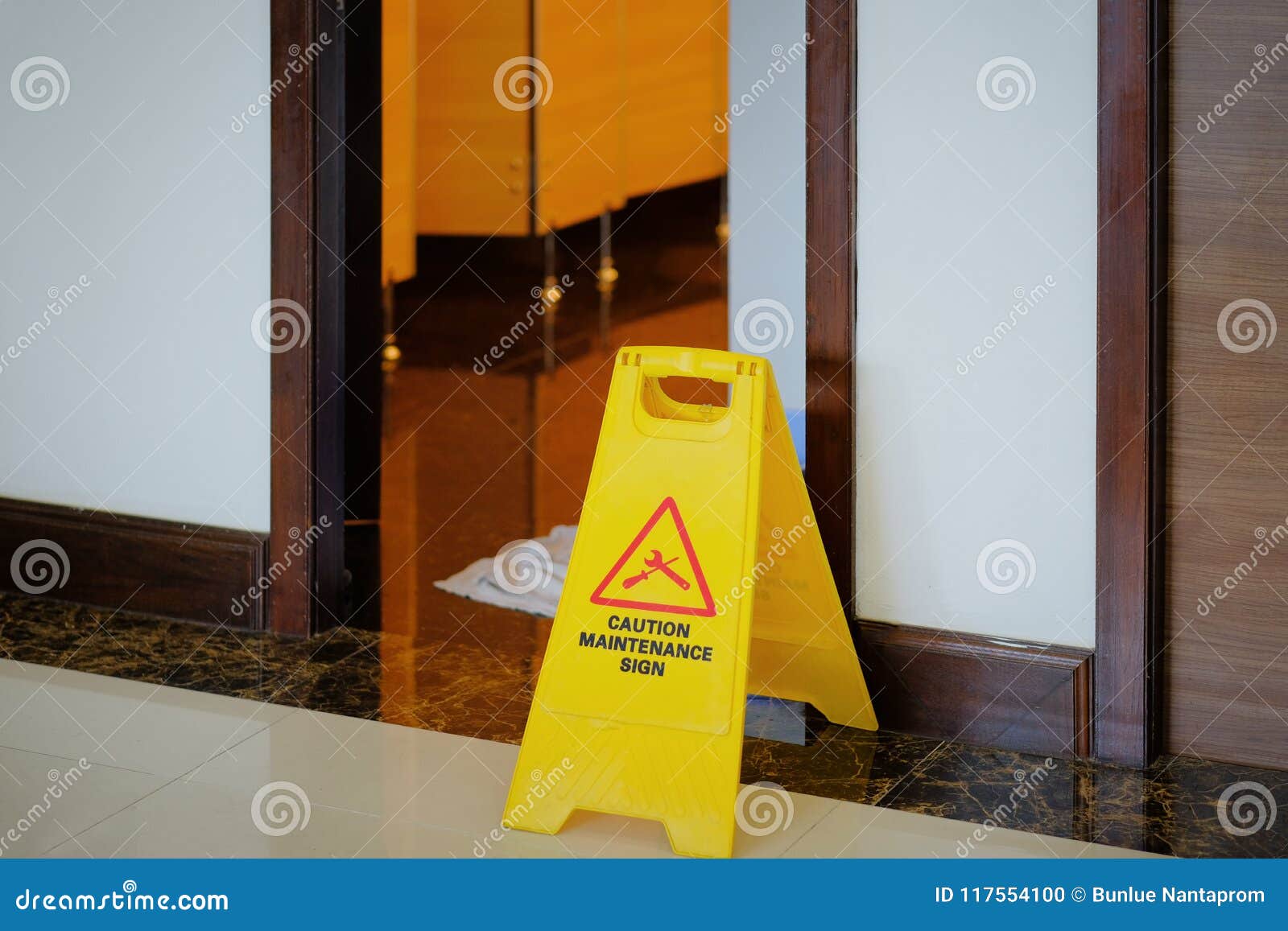 Yellow and Red Maintenance in Progress Warning Sign in Front of Stock ...