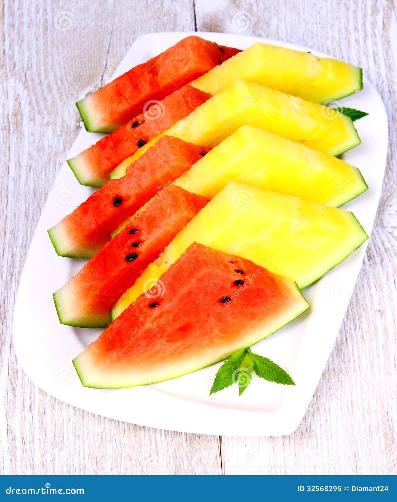 Yellow and Red Watermelon and Mint on White Plate Stock Image - Image ...