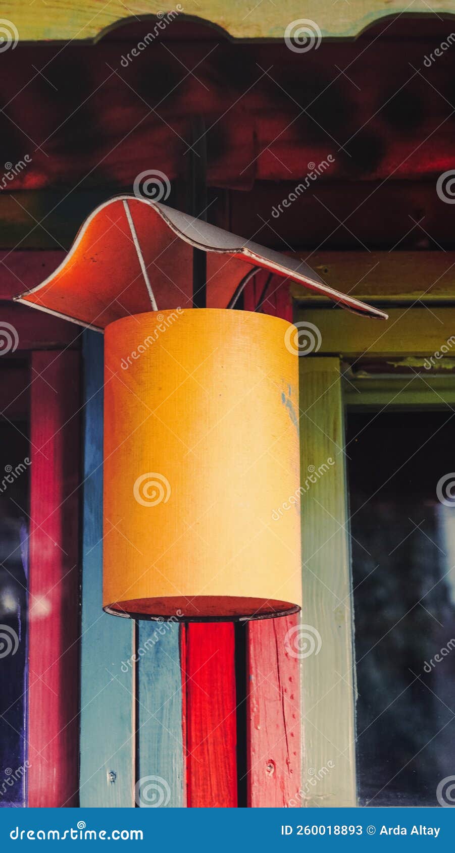 A Yellow Retro Interior Light Hanging from a Wooden Ceiling Accent ...