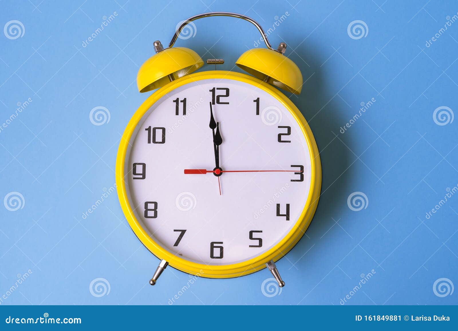 Yellow Retro Style Alarm Clock on Blue Background Stock Image - Image ...