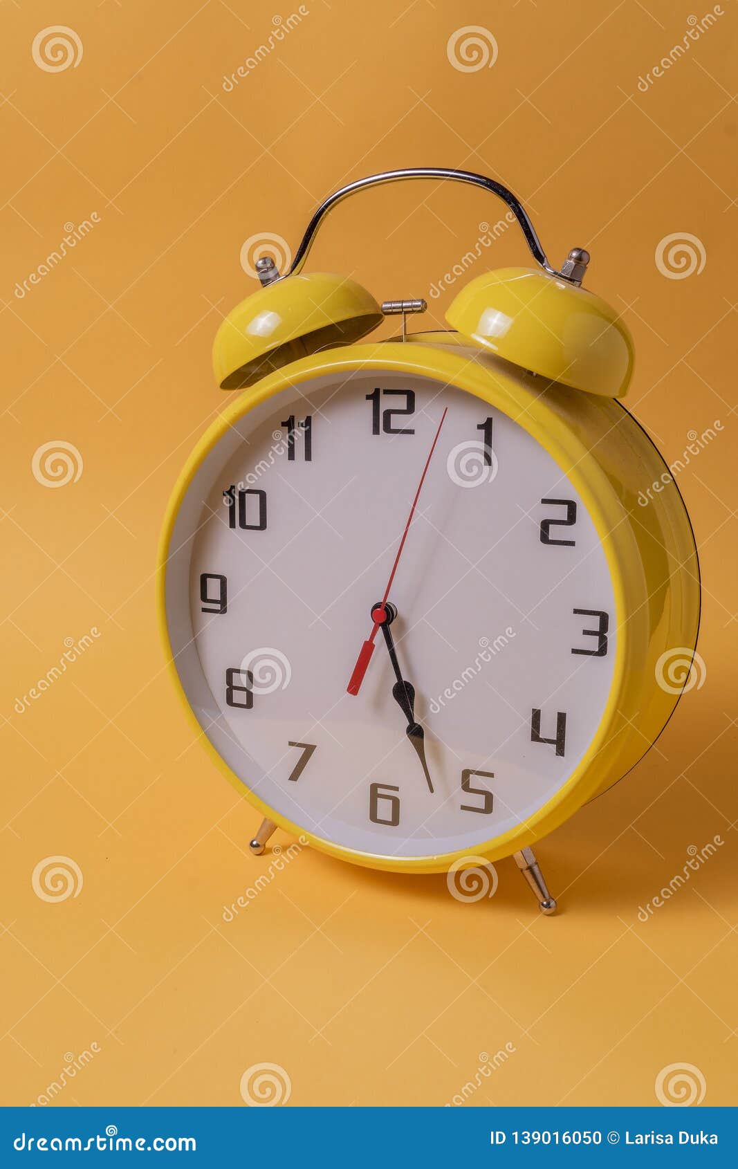 Yellow Retro Style Alarm Clock Over Yellow Background Stock Photo ...