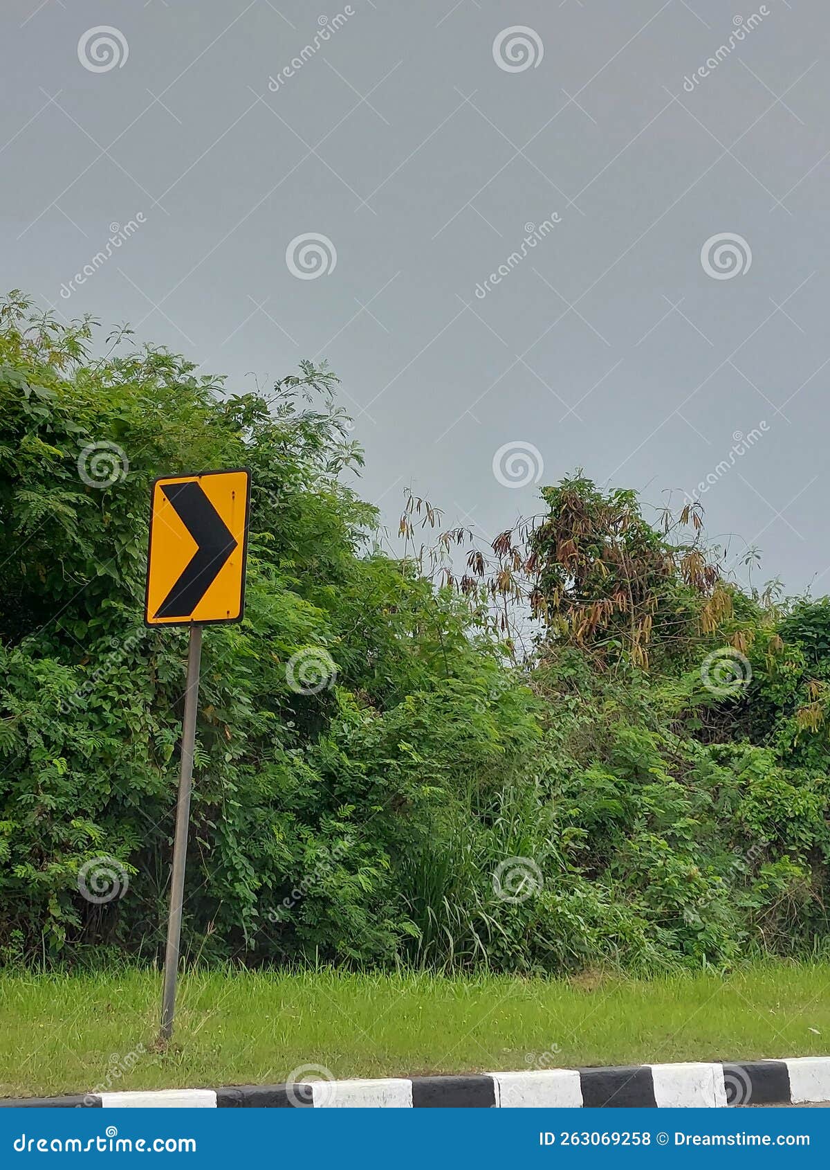Yellow Right Direction Sign on the Side Road Stock Photo - Image of ...