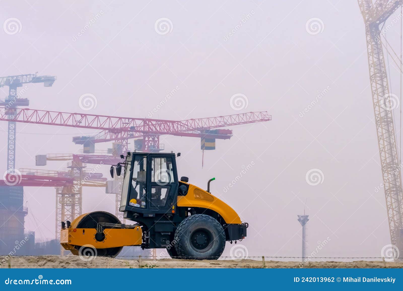 Yellow Road Compactor on a Construction Site. Construction Equipment on ...