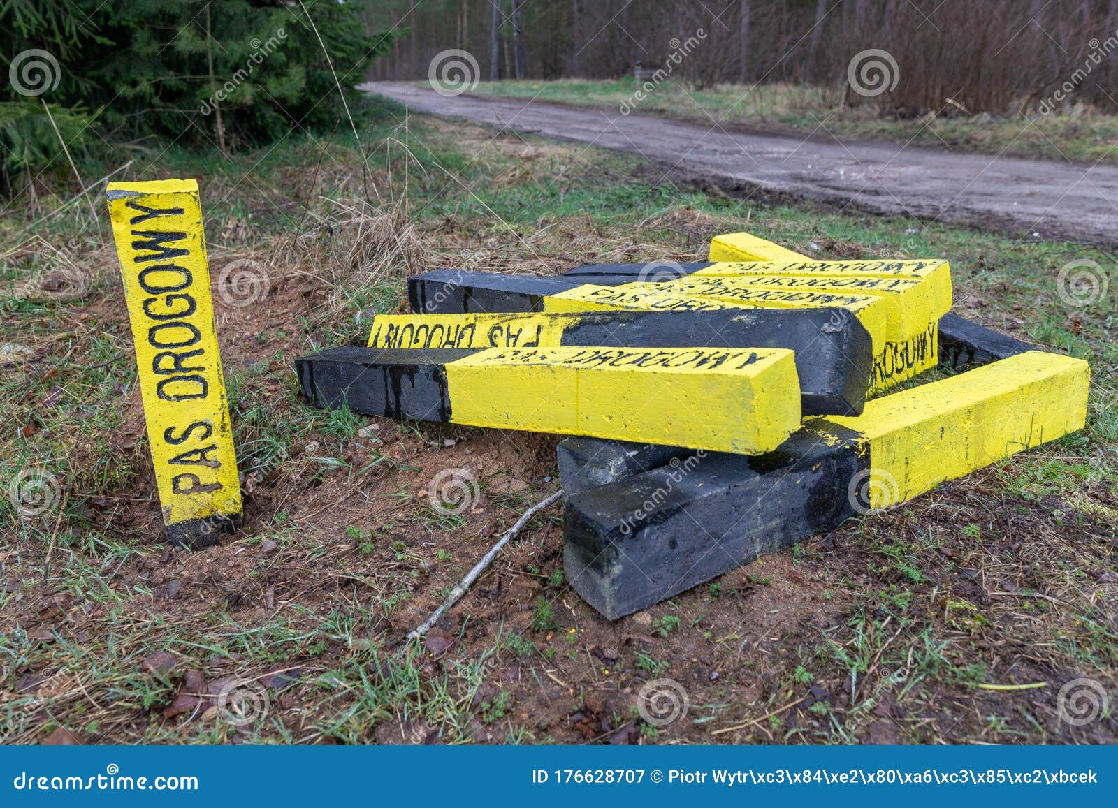 A Yellow Road Post Standing by the Road. Marking of the Road Lane on ...