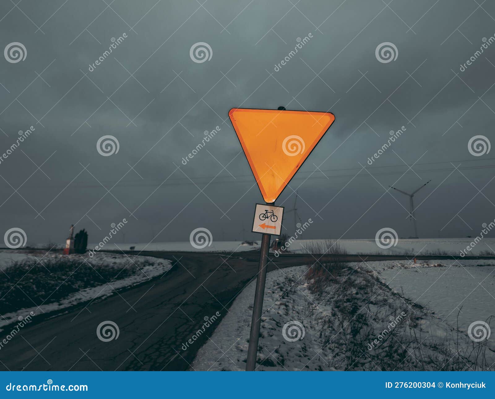 Yellow Road Sign at Crossroads in Winter Stock Photo - Image of cloudy ...
