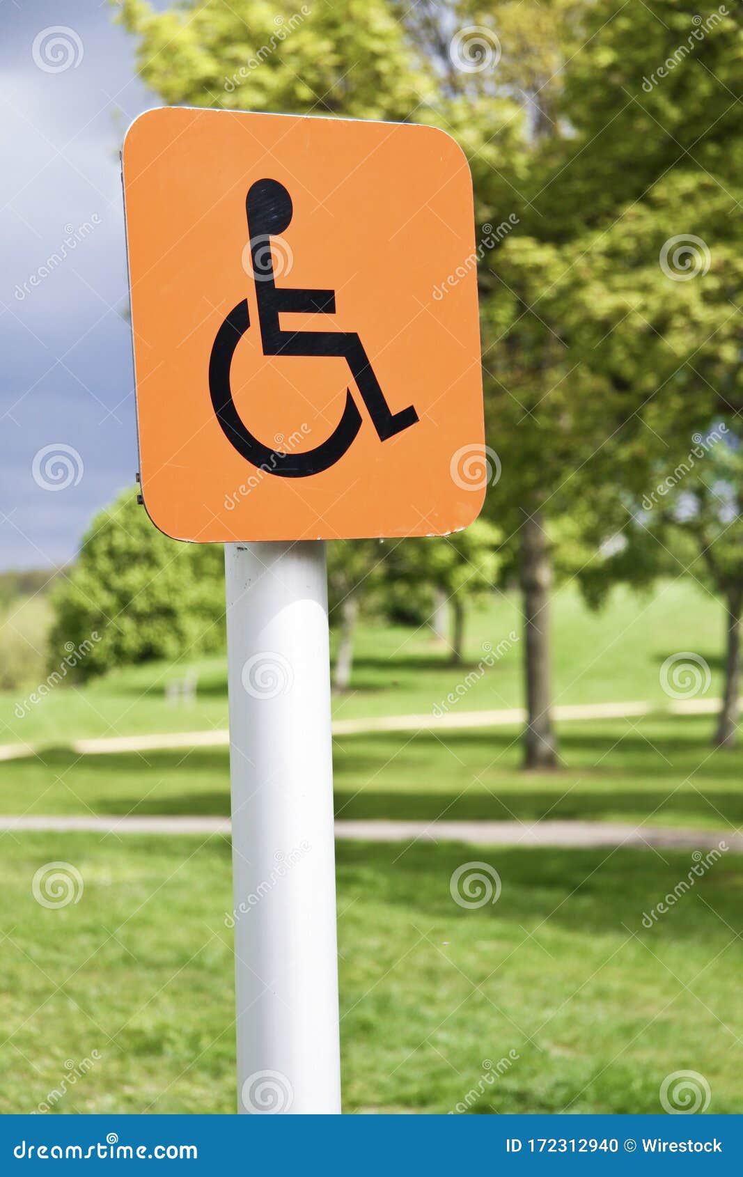Yellow Road Sign for Disabled People Surrounded by Greenery Under the ...
