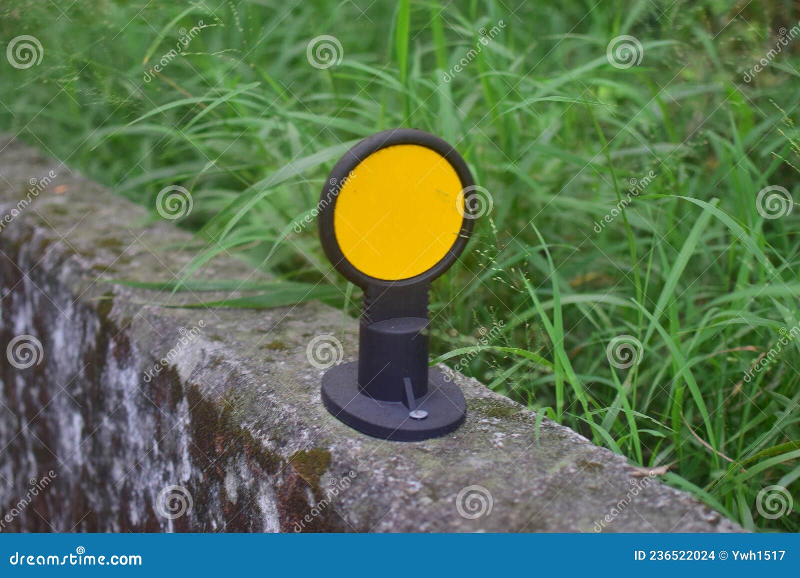 Yellow Roadside Reflector by the Side of Street Stock Photo - Image of ...