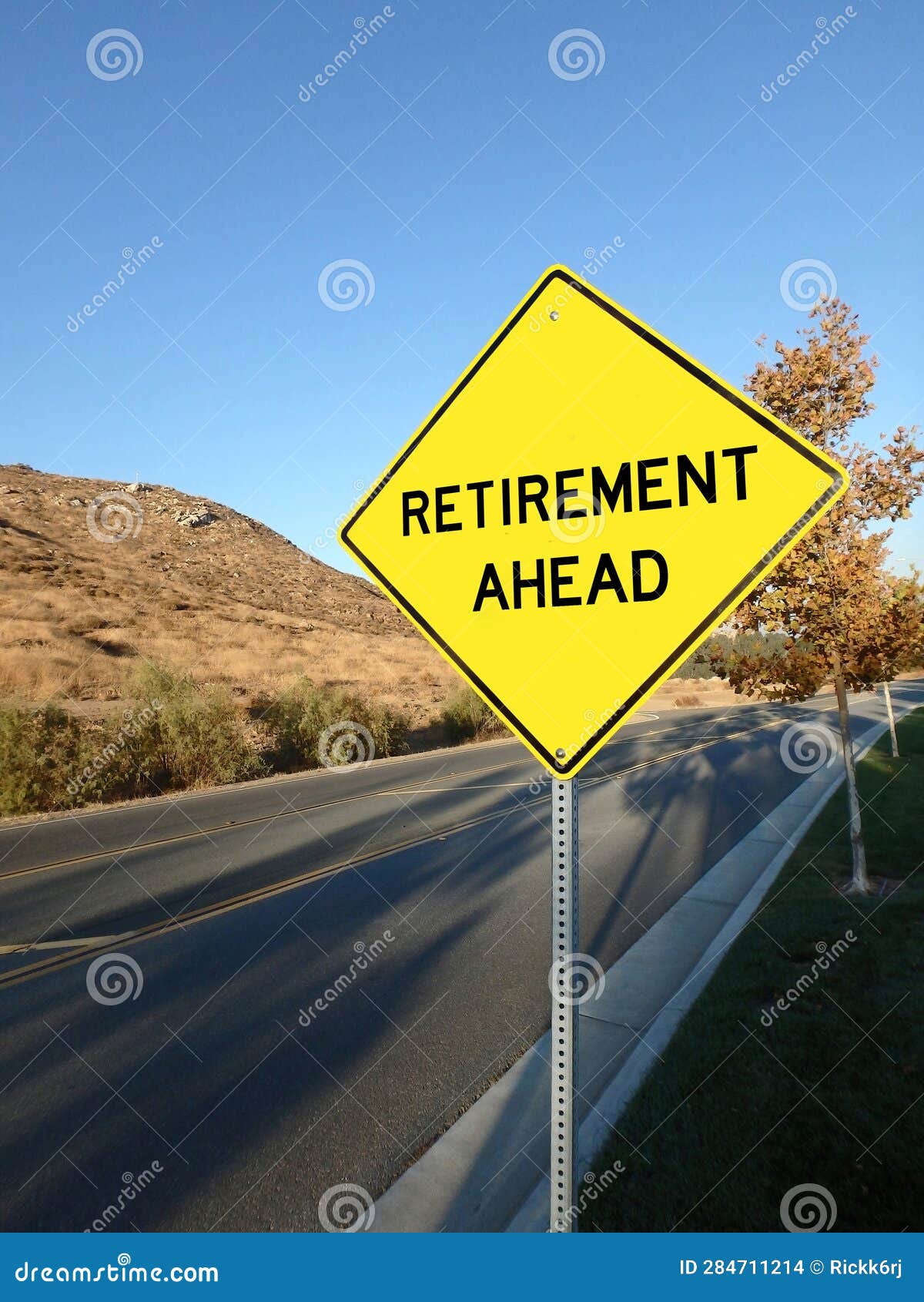 Yellow Roadside Warning Sign Warning of Retirement Ahead. Stock Photo ...