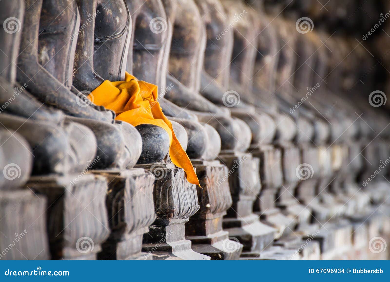 Yellow Robe of Monks on the Lap of the Buddha. Stock Photo - Image of ...