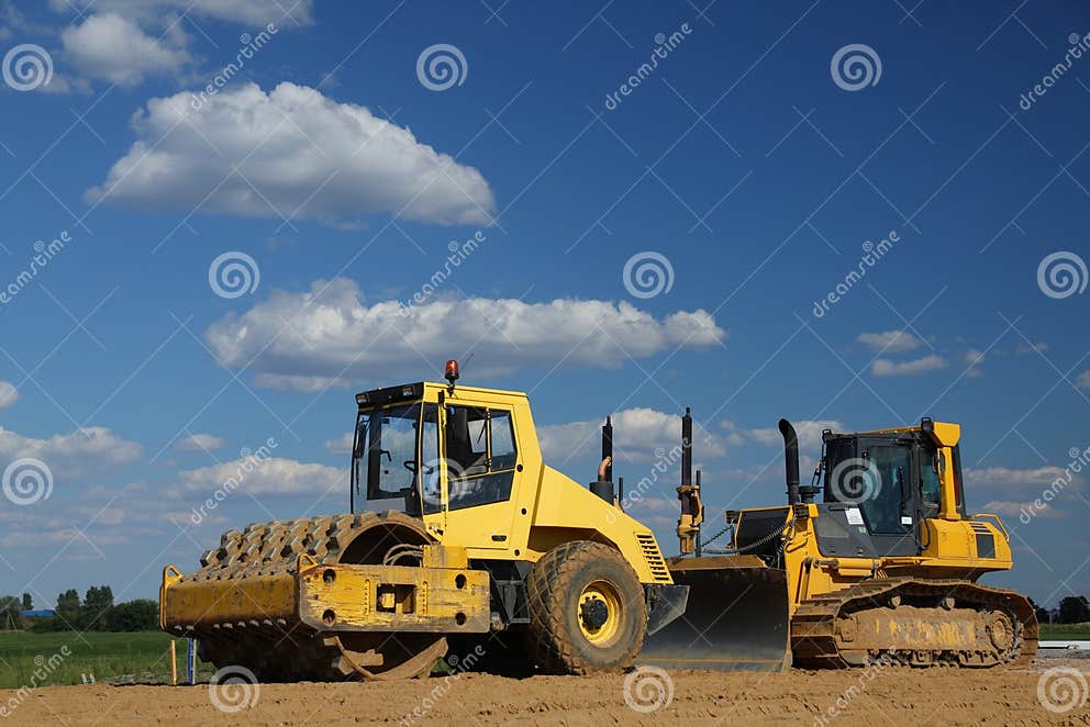 Yellow Roller and Bulldozer Over Blue Sky Stock Image - Image of ...