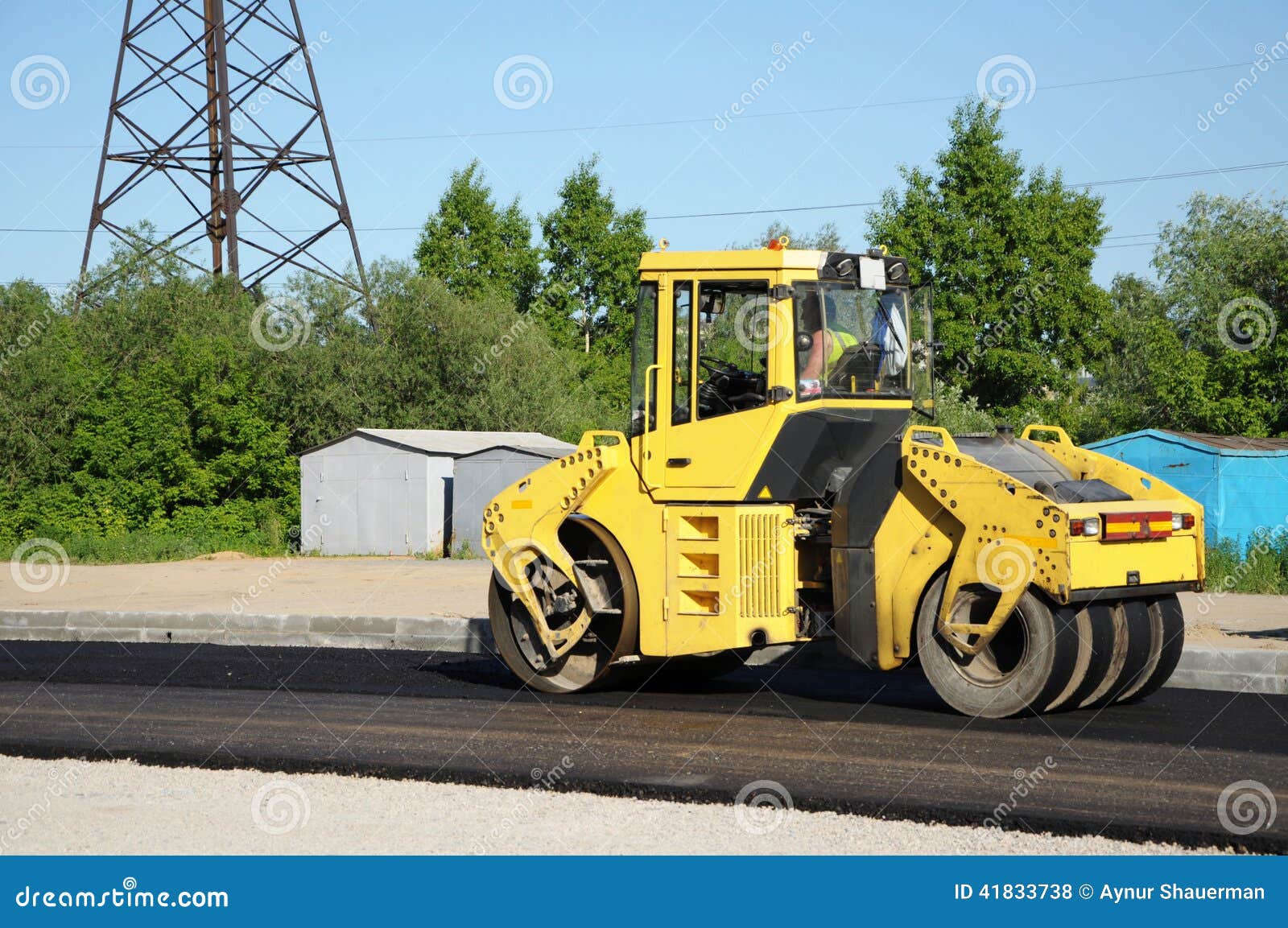 Yellow Rolling Machinery Paving a Road Editorial Stock Photo - Image of ...