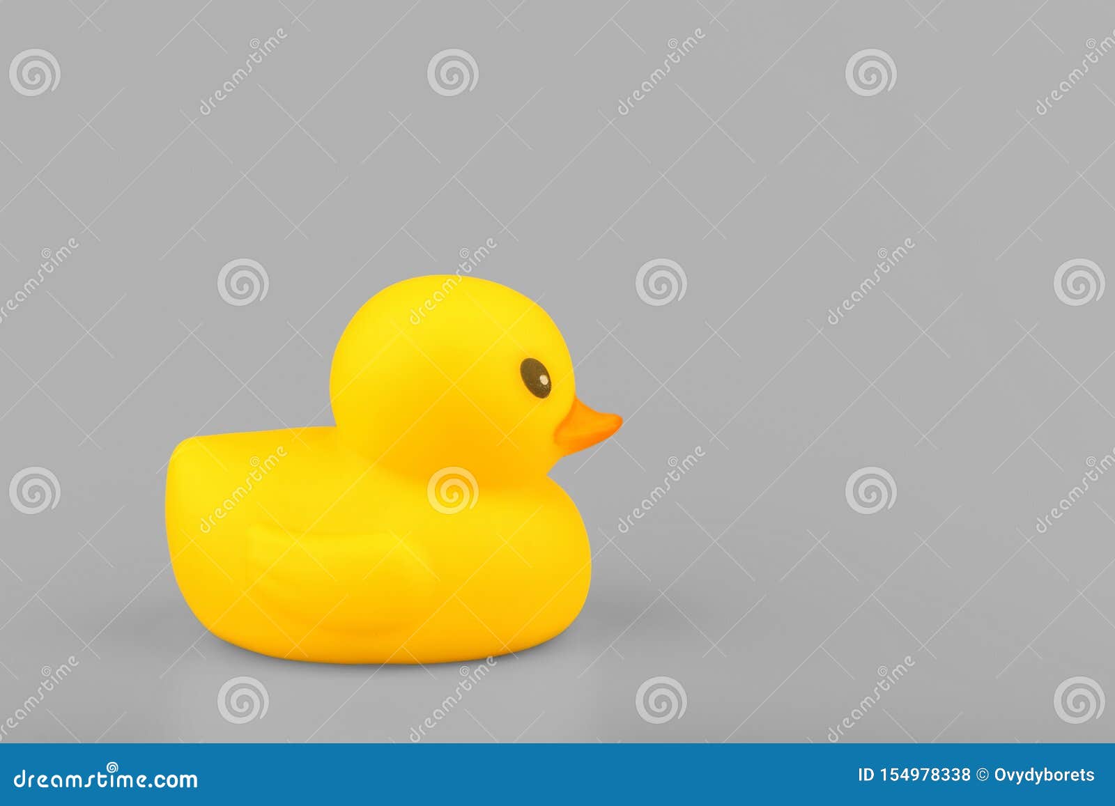 Yellow Rubber Duck on Grey Background Stock Photo - Image of bathroom ...