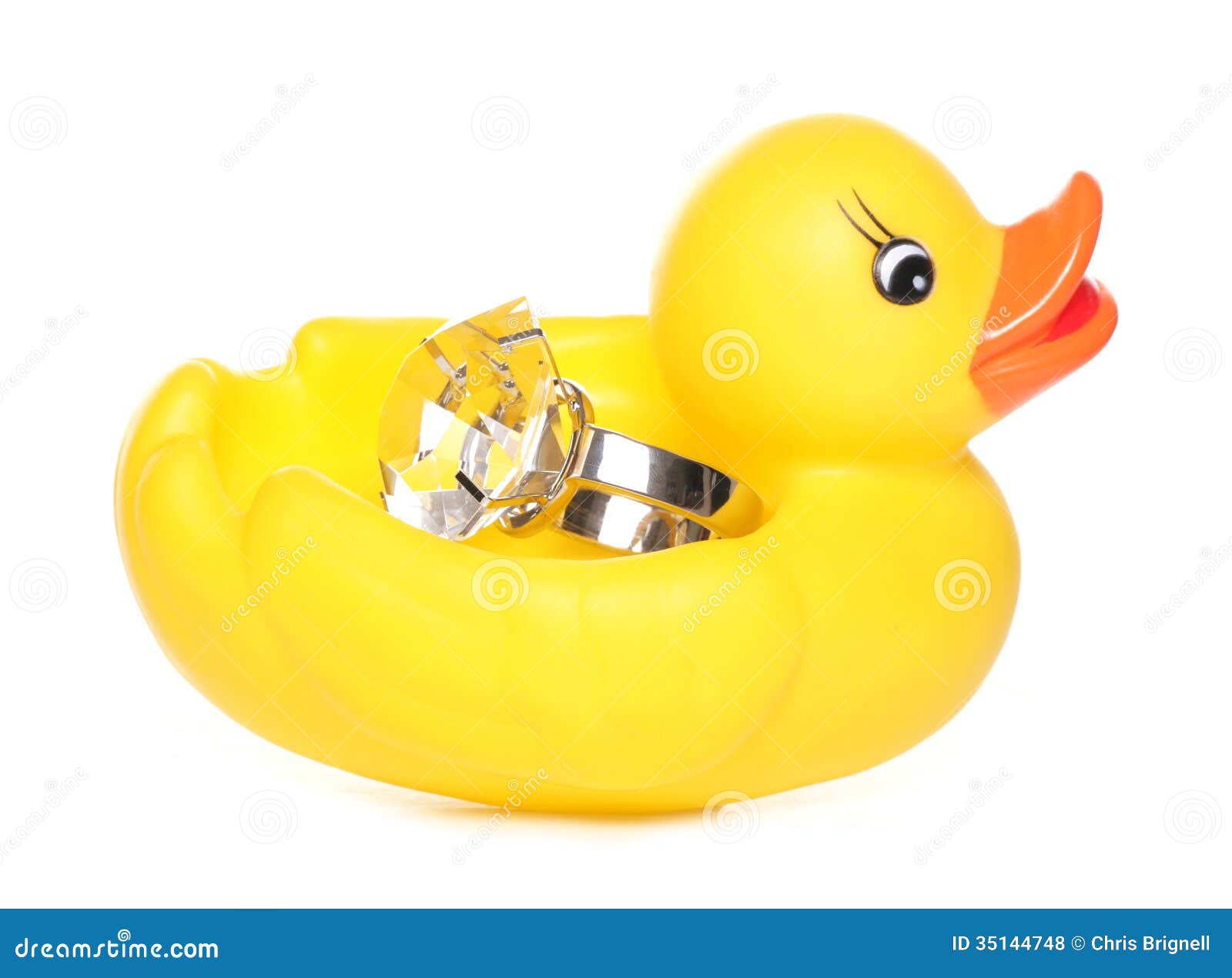 Yellow Rubber Duck Holding a Diamond Ring Stock Photo - Image of ...