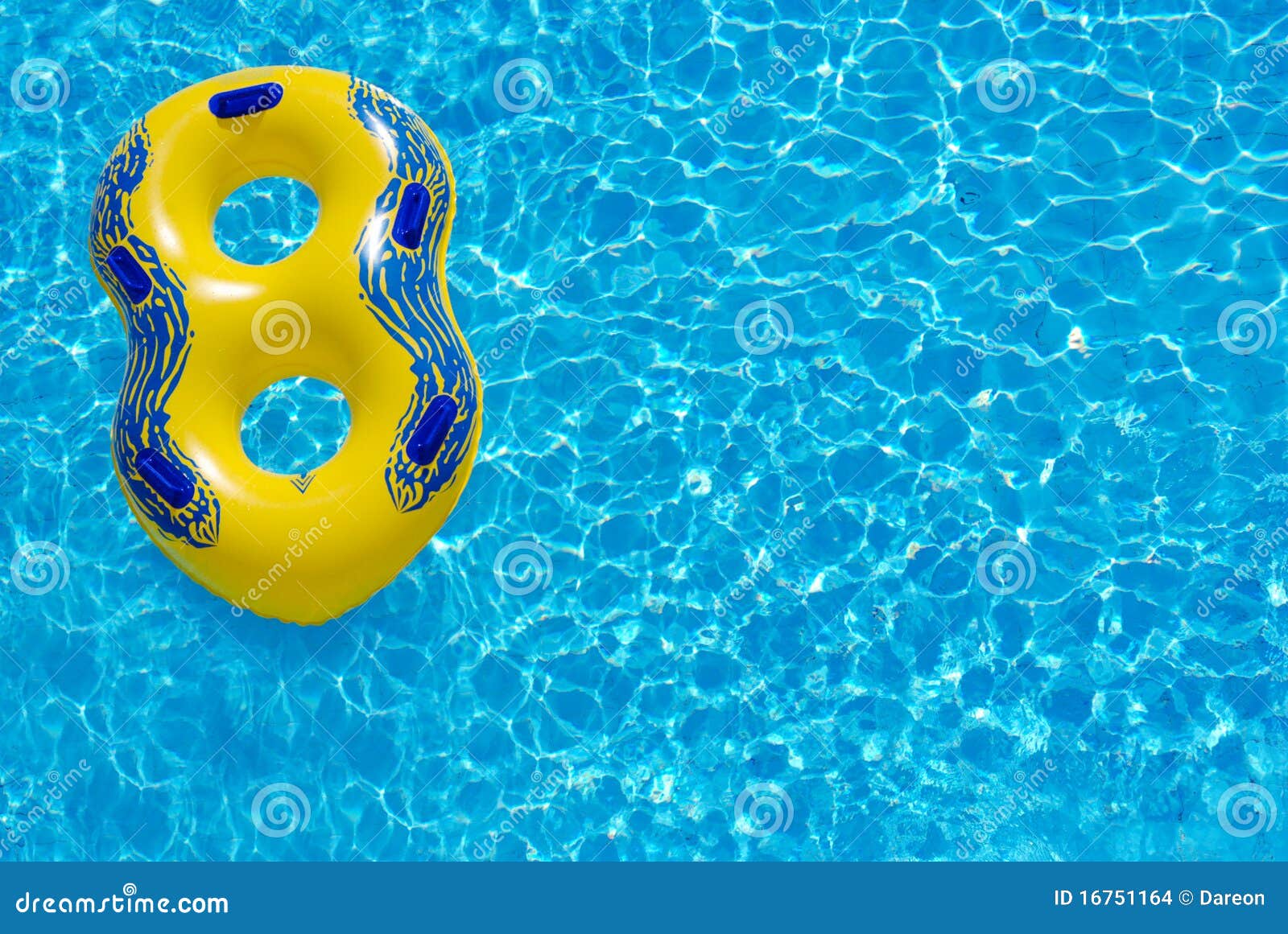 Yellow Rubber Ring Floating on Blue Water Stock Photo - Image of ...