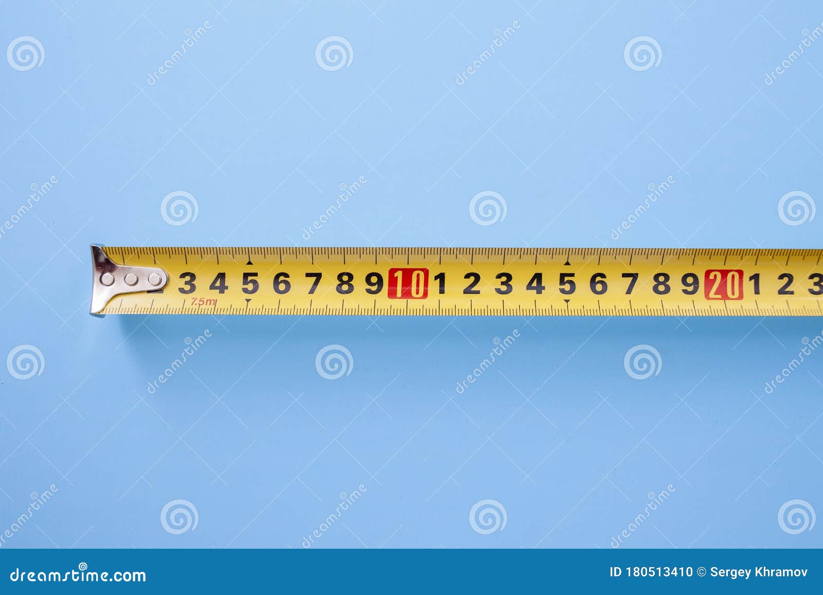 Yellow Ruler on a Blue Background Stock Photo - Image of millimeter ...