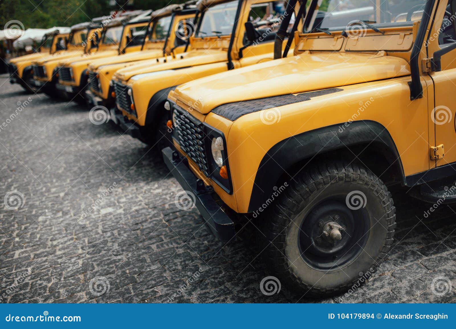 Yellow safari trucks stock photo. Image of remote, standing - 104179894