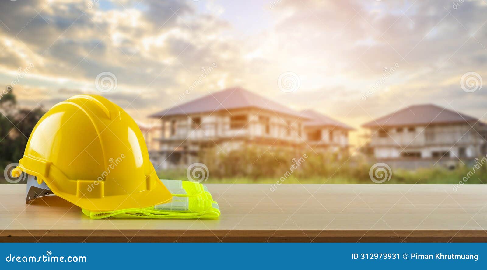 Safety Construction Helmet on Wood Table with Construction Site ...