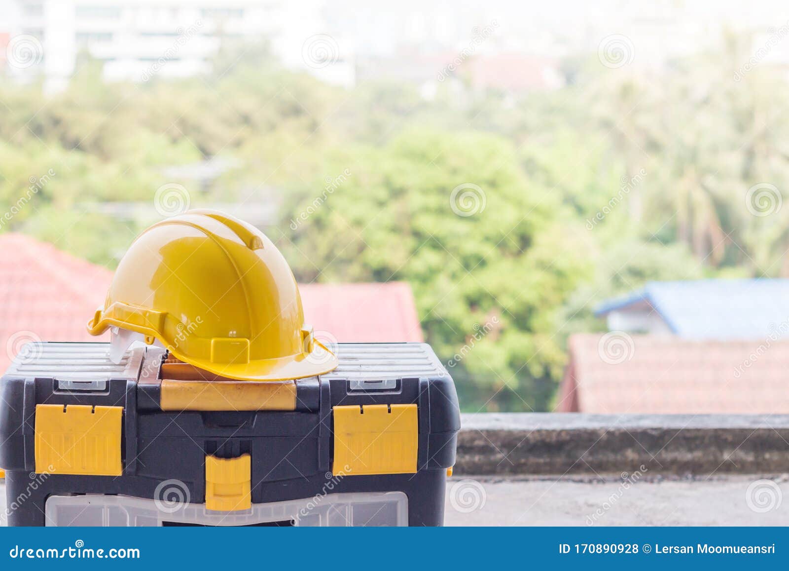 The Yellow Safety Helmet on the Tool Box at Construction Site Stock ...