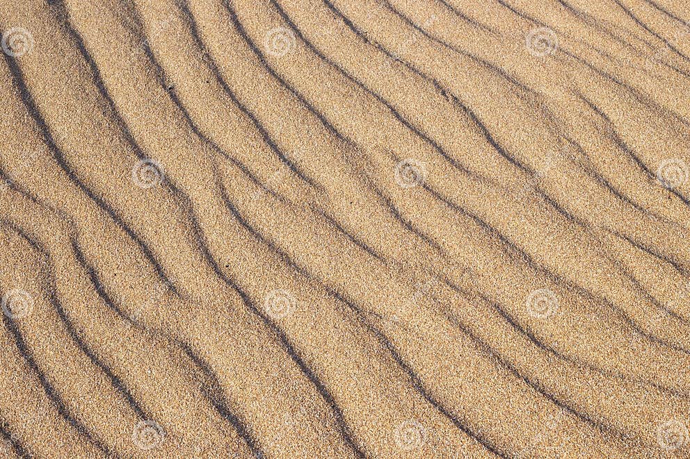 Yellow Sand with a Wavy Pattern, Top View. Background, Texture Stock ...