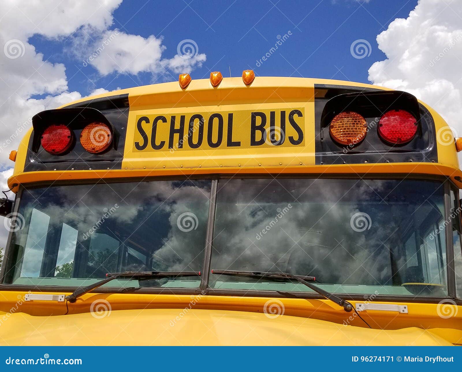 Yellow School Bus with Cloud Reflection Stock Image - Image of vivid ...