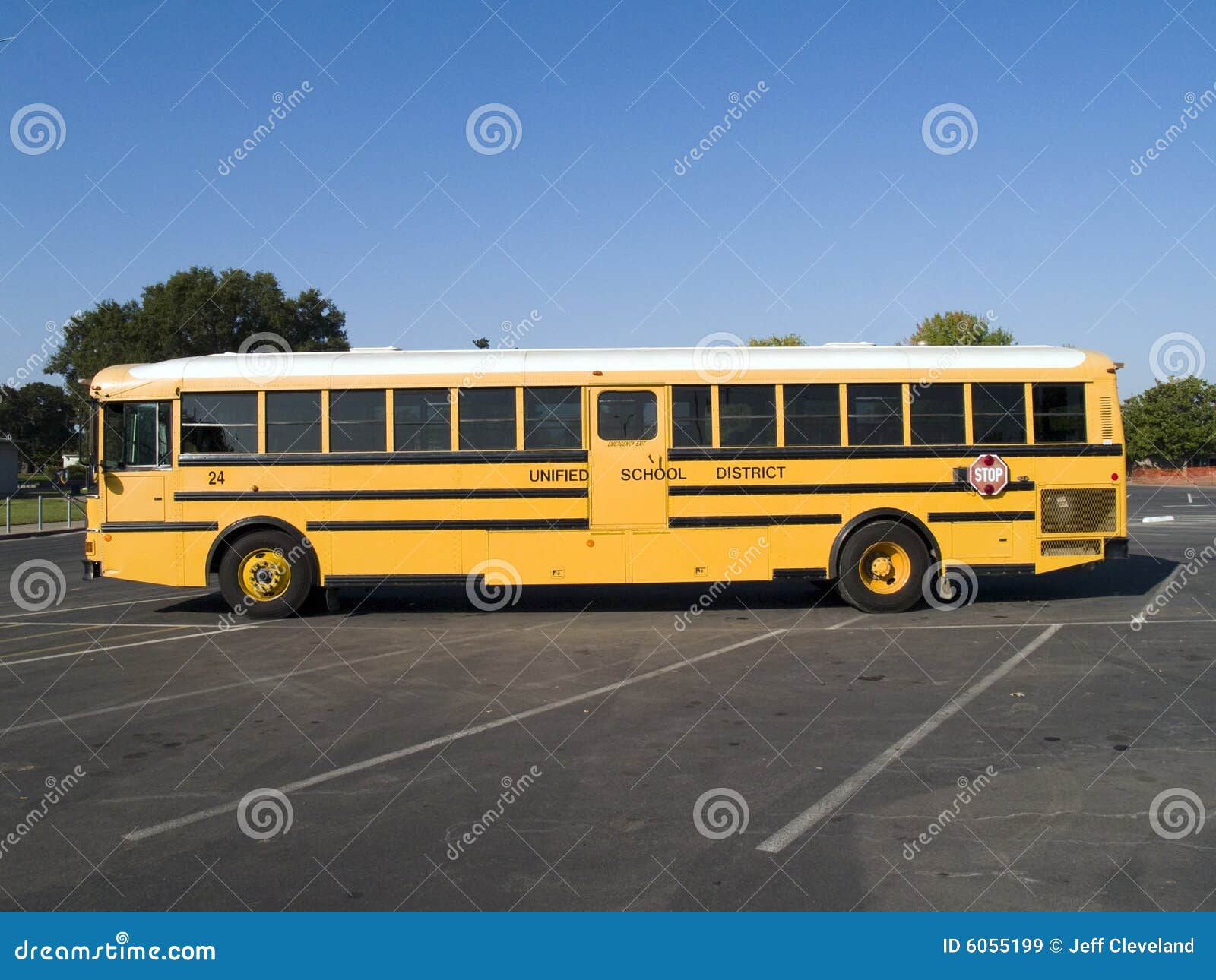 Yellow School Bus in School Parking Lot Stock Image - Image of blue ...