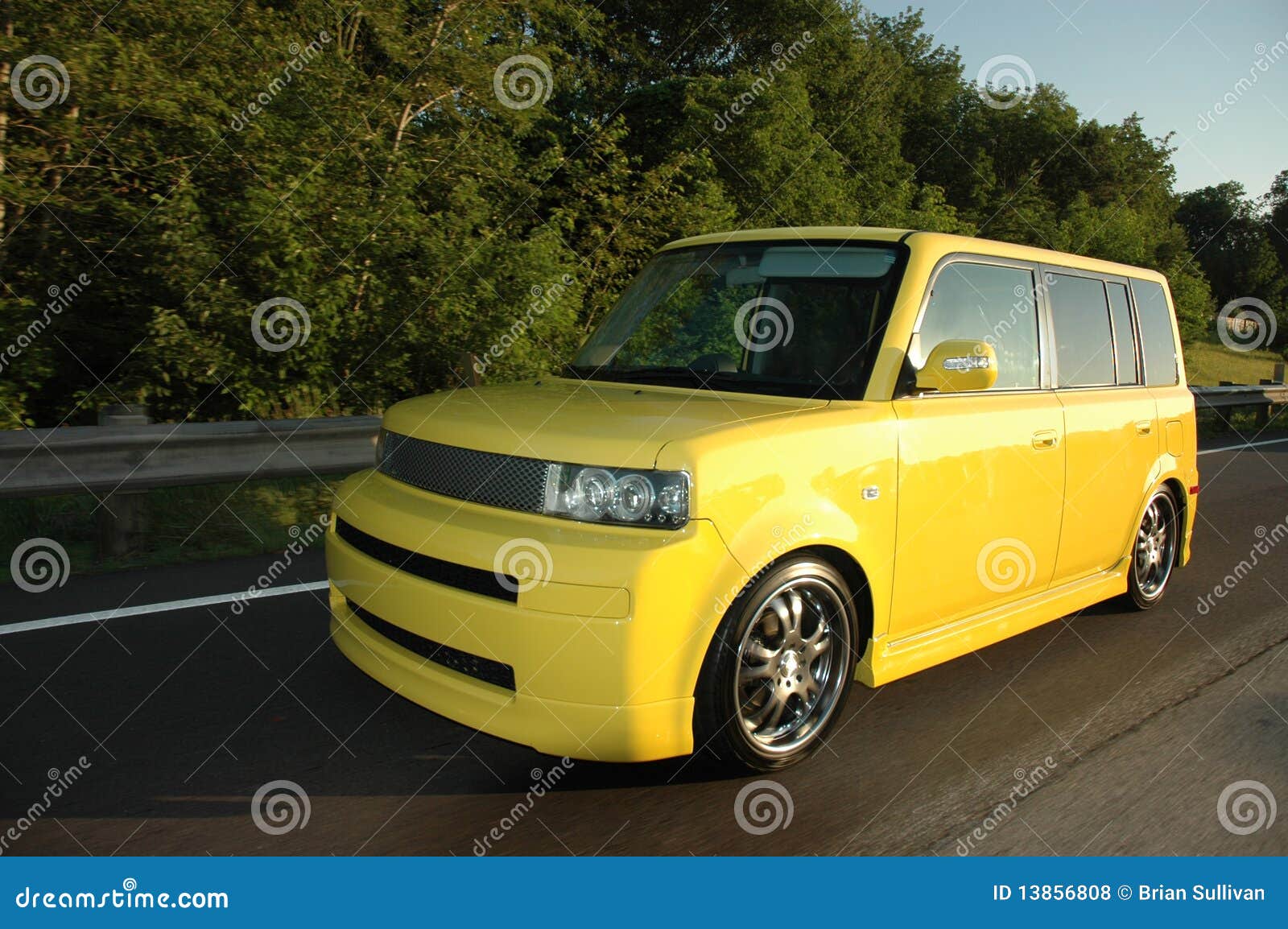Yellow Car Driving In Heavy Snowfall On Highway Road In Pine Forest ...