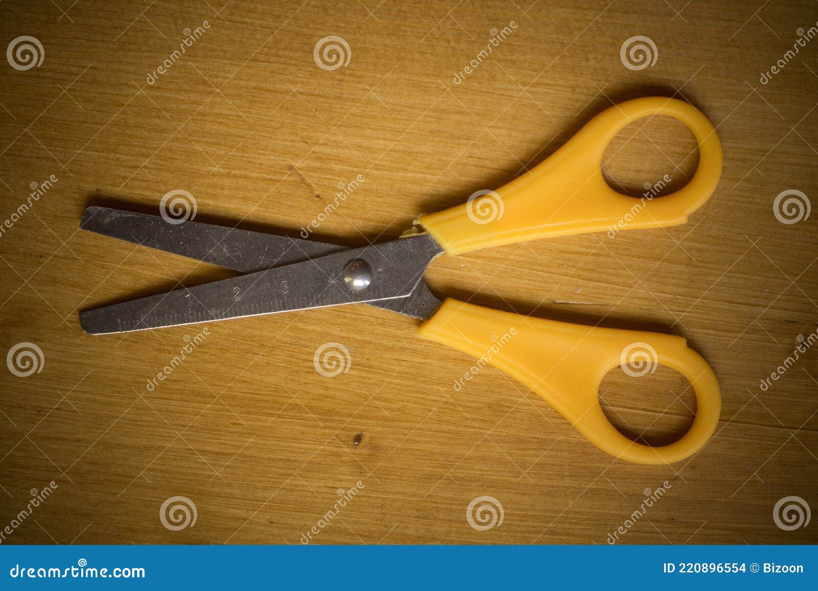 Yellow scissors with ruler stock photo. Image of yellow - 220896554