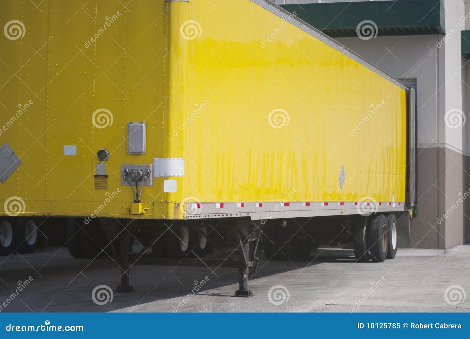Yellow Semi Trailer at Warehouse Stock Image - Image of yellow, trailer ...