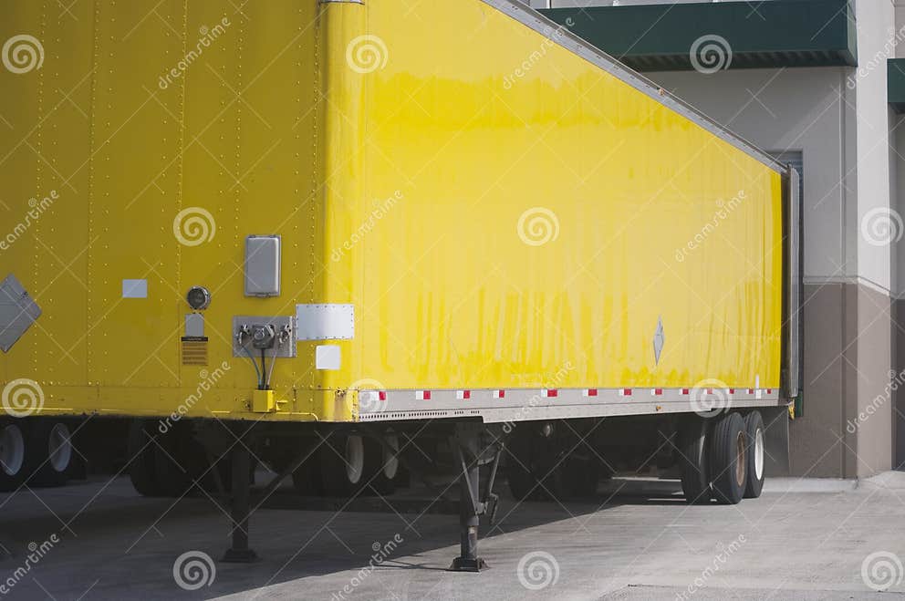 Yellow Semi Trailer at Warehouse Stock Image - Image of yellow, trailer ...