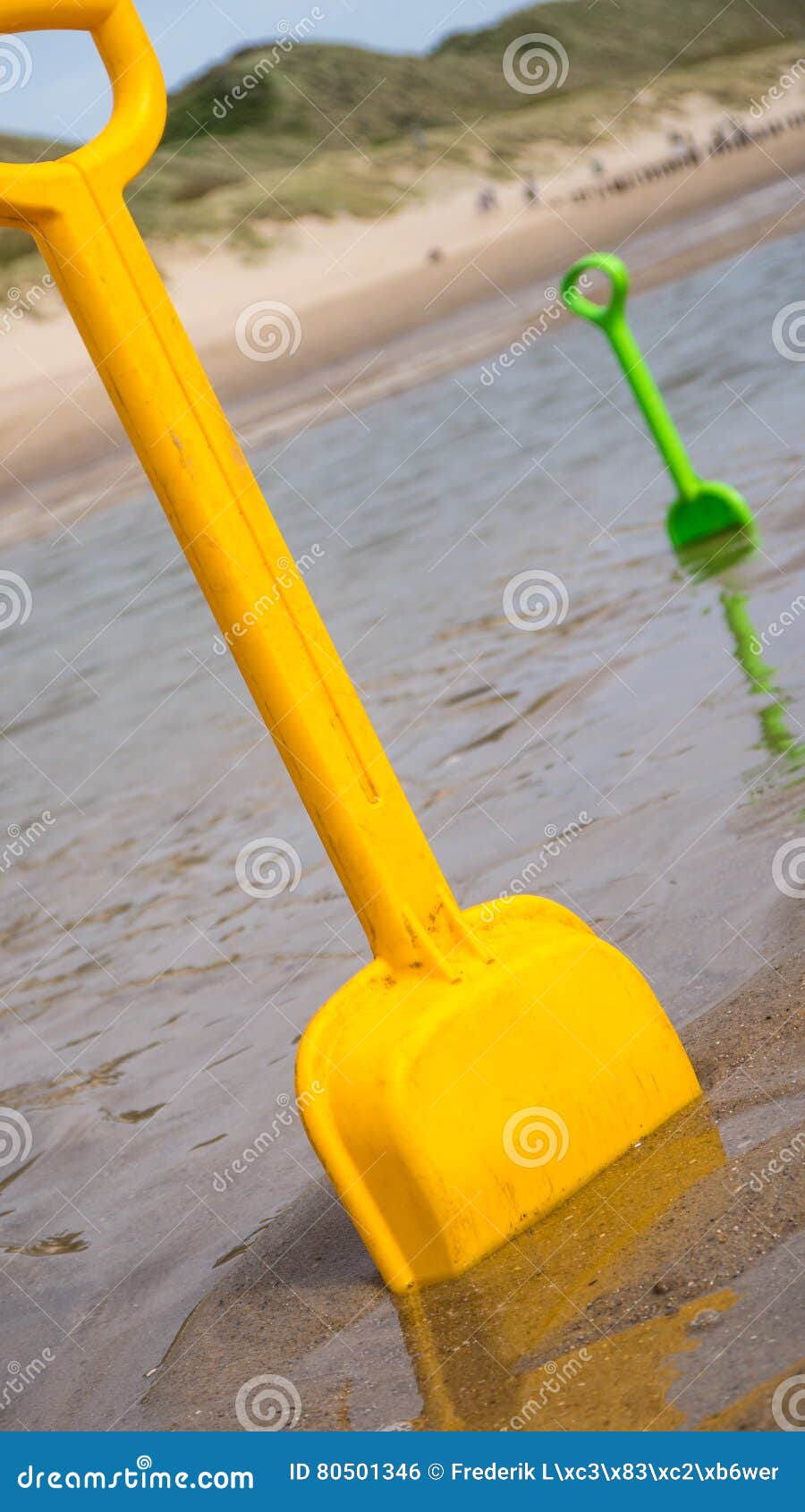 Yellow Shovel Standing on a Beach Stock Photo - Image of nature, child ...