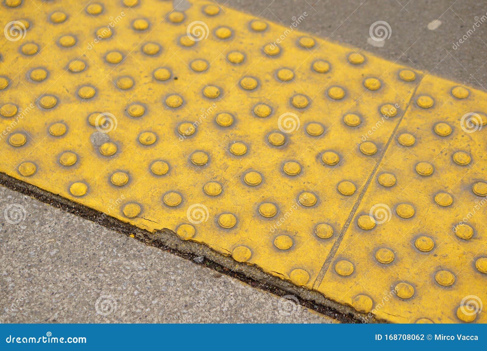 Yellow Sidewalk Plate Round with Knobs Stock Photo - Image of plate ...